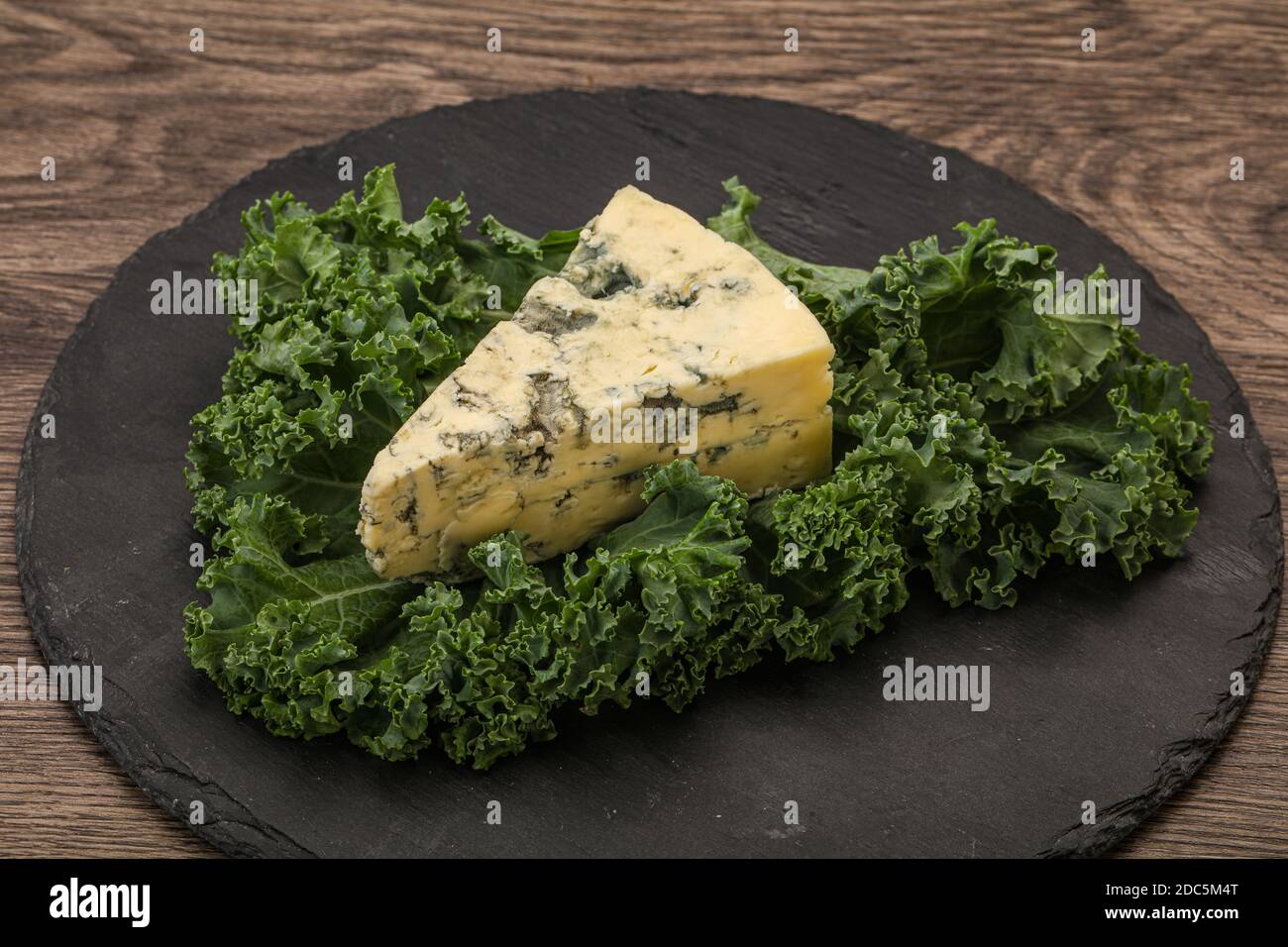Dairy Blue cheese triangle with mold Stock Photo - Alamy