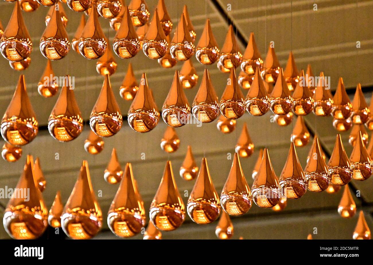 Close up view of suspended bronze droplets which are part of a dynamic ...