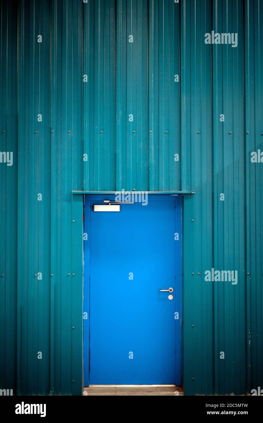Blue industrial unit door Stock Photo - Alamy