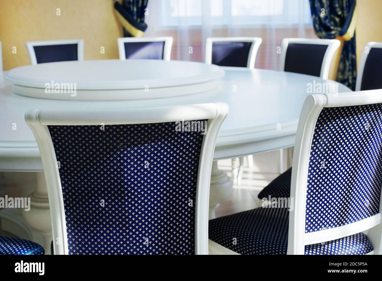 Empty white round conference table and chairs. Resolving conflicts and ...