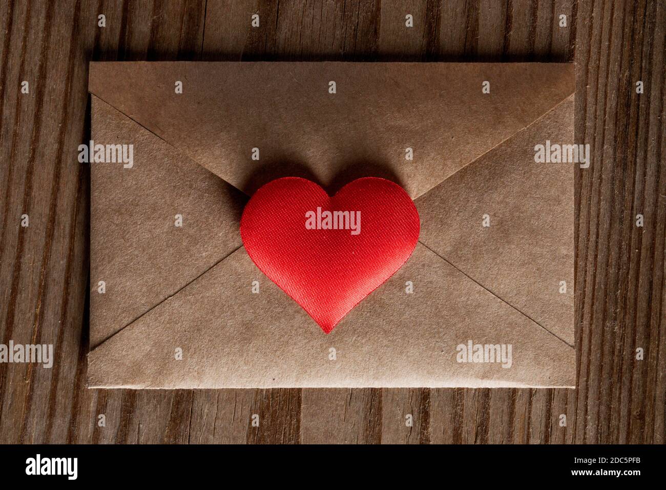 Valentine day love letter, envelope of craft paper with red heart on ...