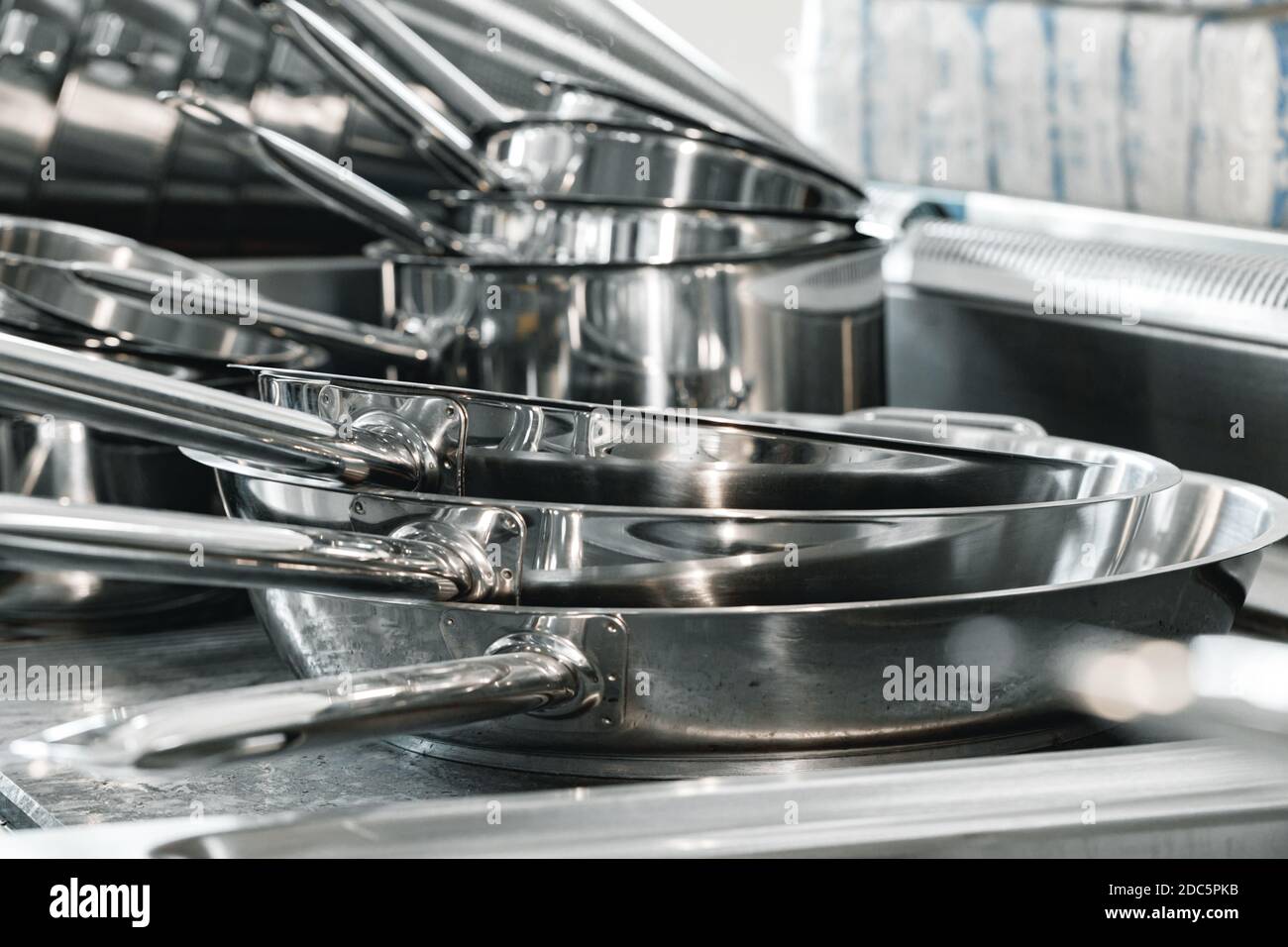 Stacked industrial metal cooking pots on proffesional kitchen Stock ...