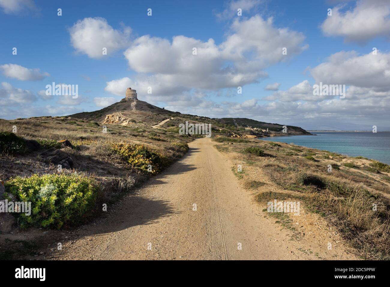 A pathway near the sea under a cloudy sky Stock Photo - Alamy
