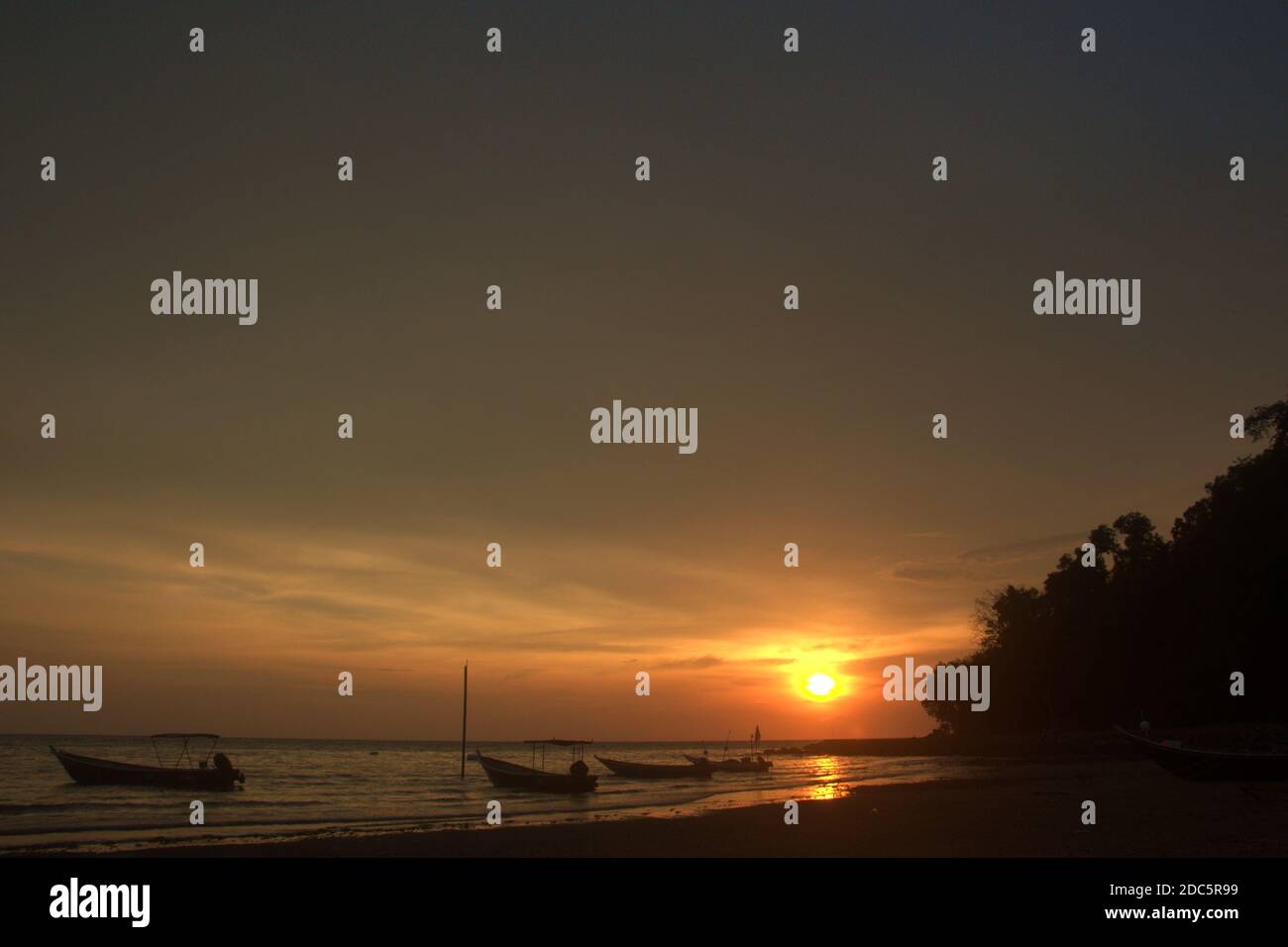 fishing boat under sunset at Teluk Kemang beach in Port Dickson ...