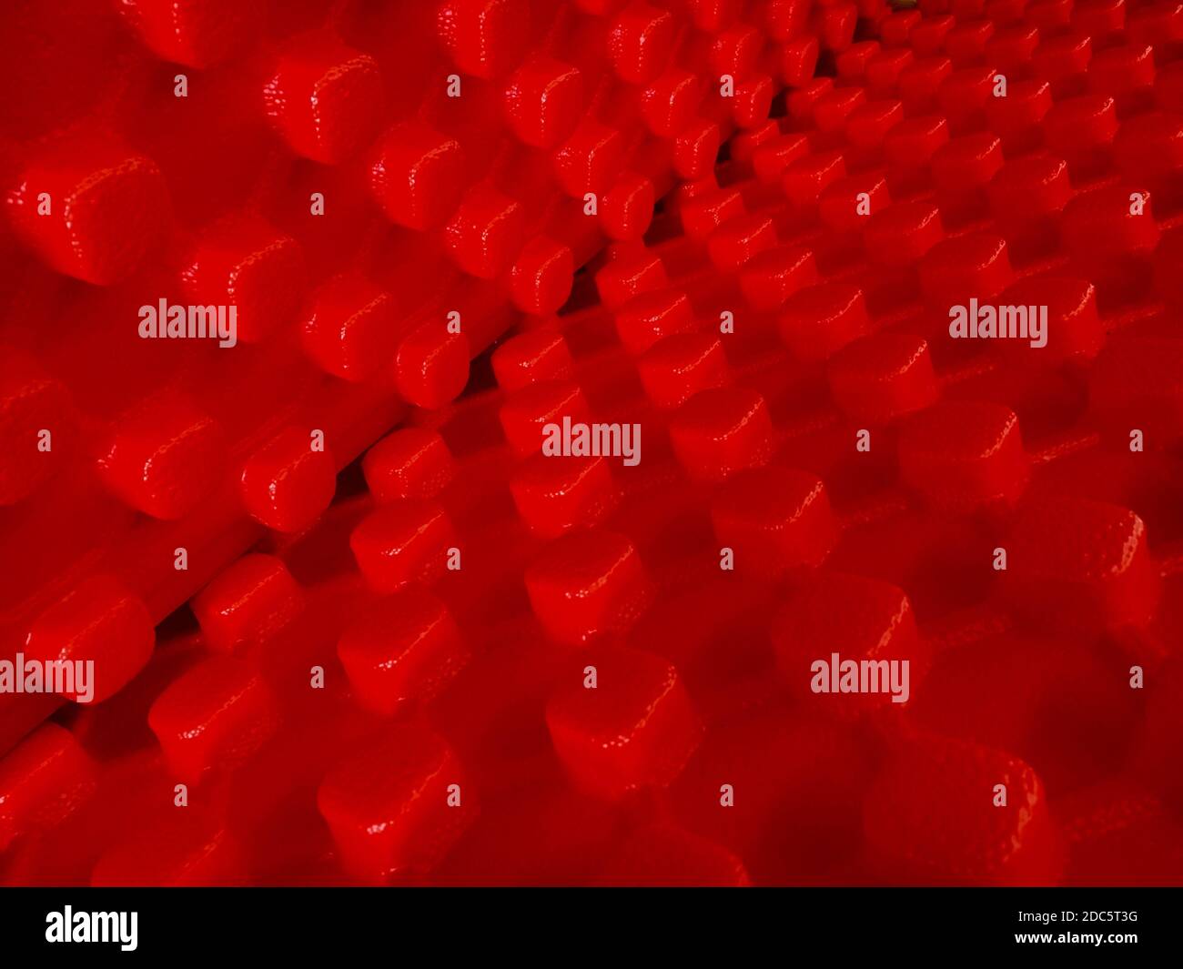 A cool background or wallpaper of vibrant red-colored pips-out brick ...