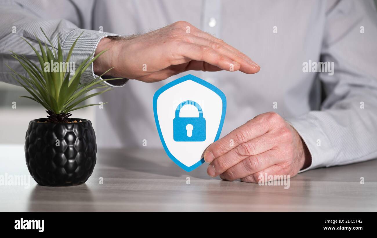 Concept of protection and security with paper shield protected by male ...