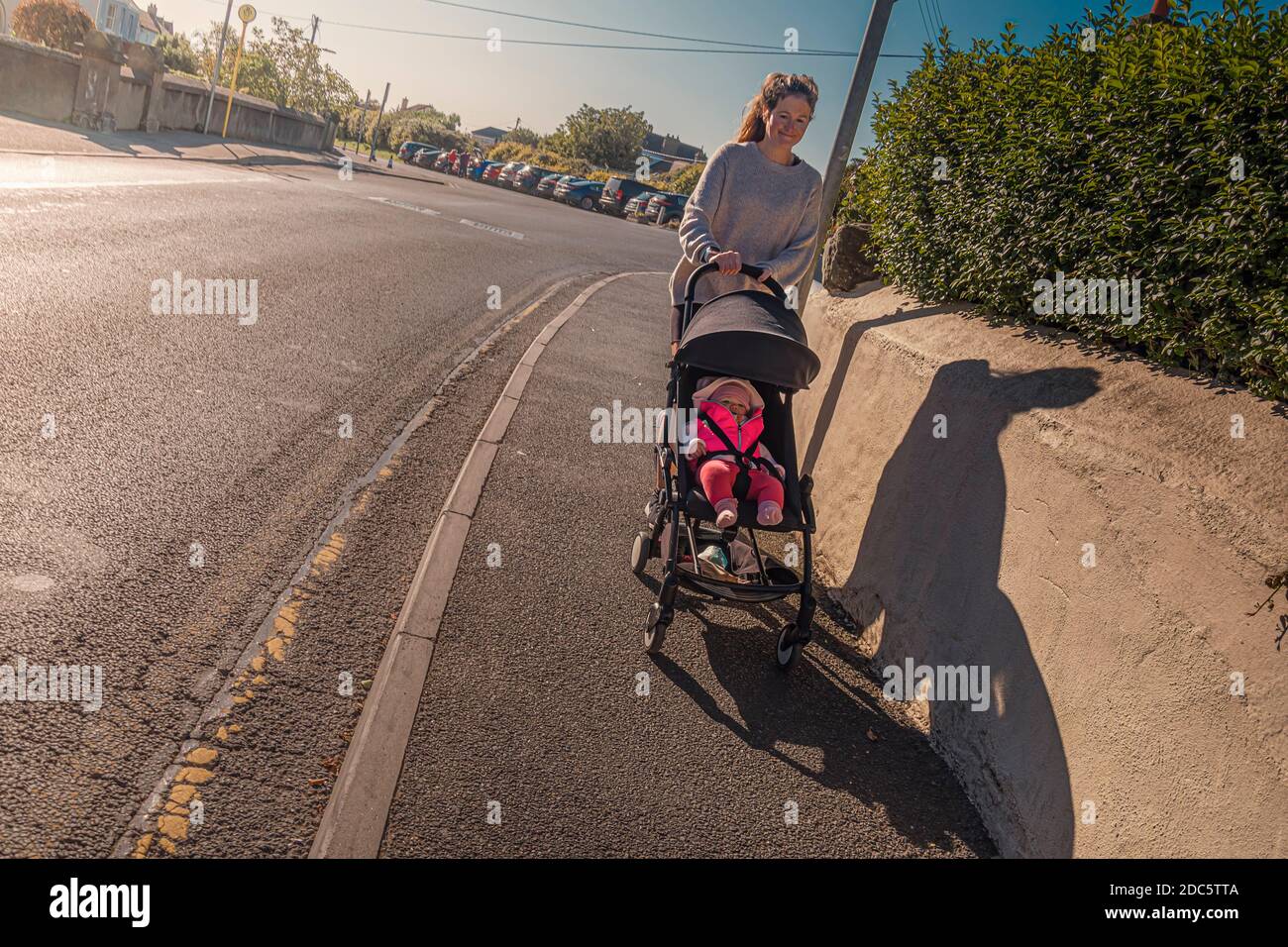 Lady pushing pram hi-res stock photography and images - Alamy