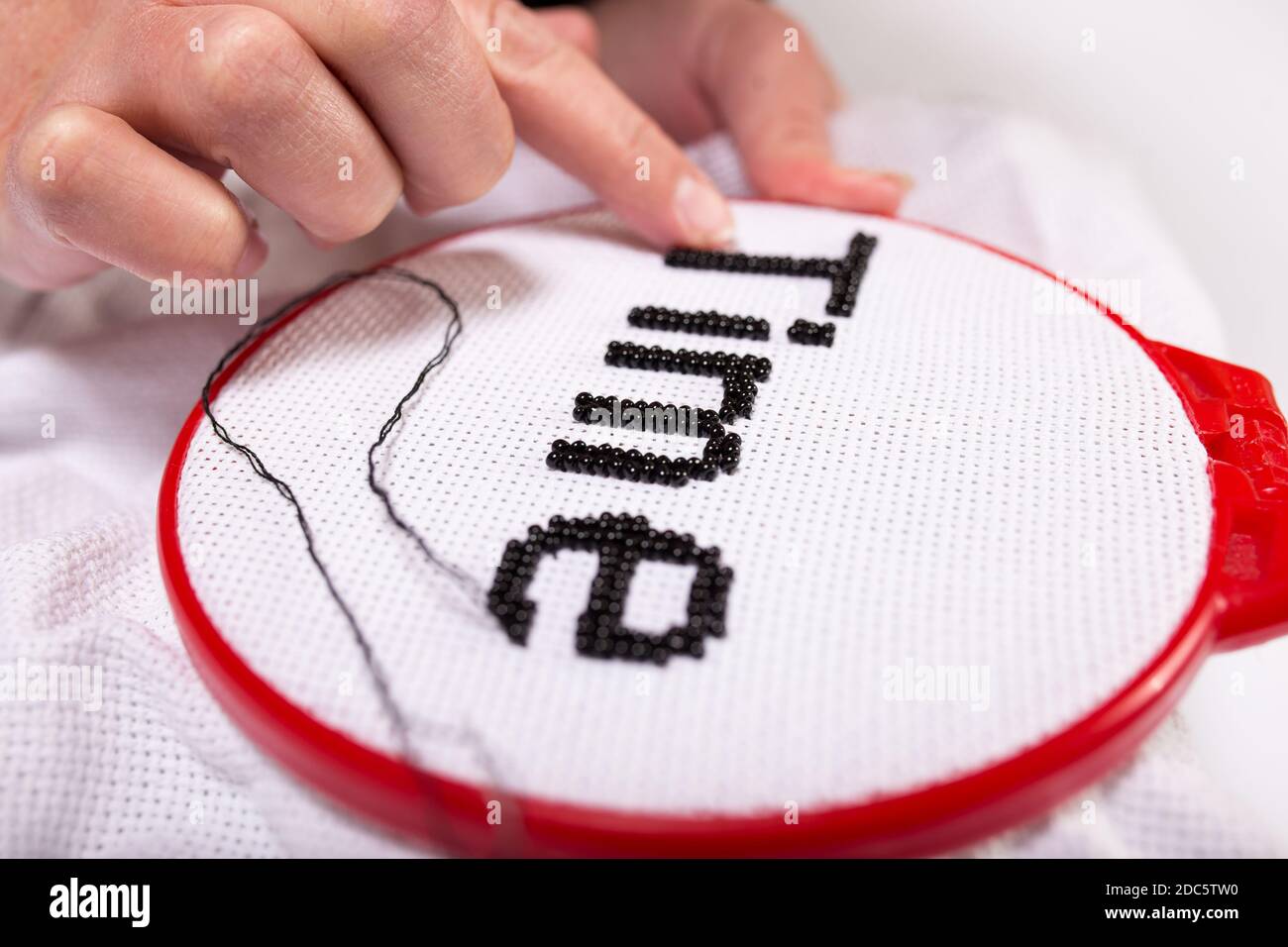 But embroidering letters hi-res stock photography and images - Alamy