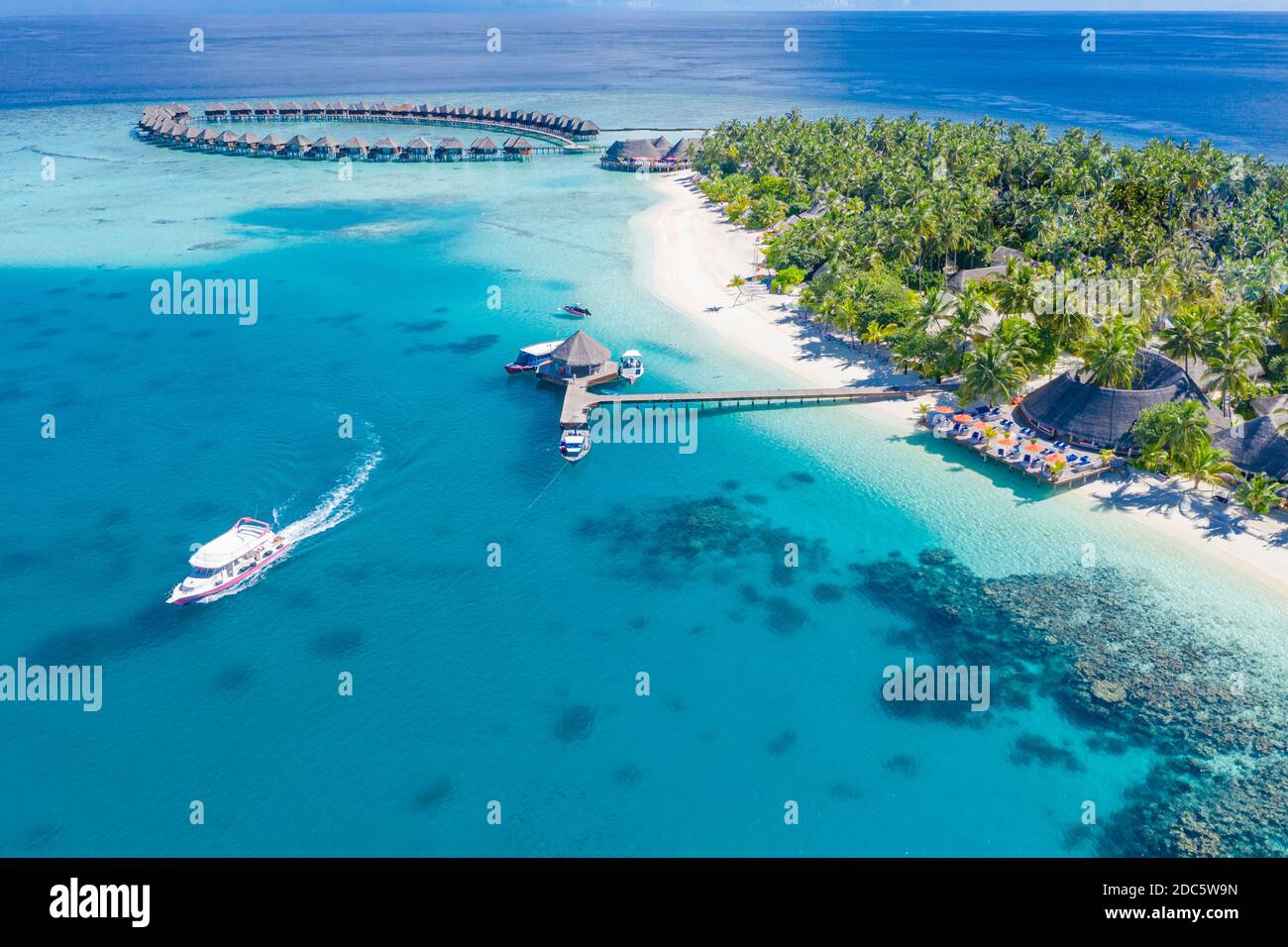 Aerial landscape with tropical resort villas, bungalow, palm trees and ...
