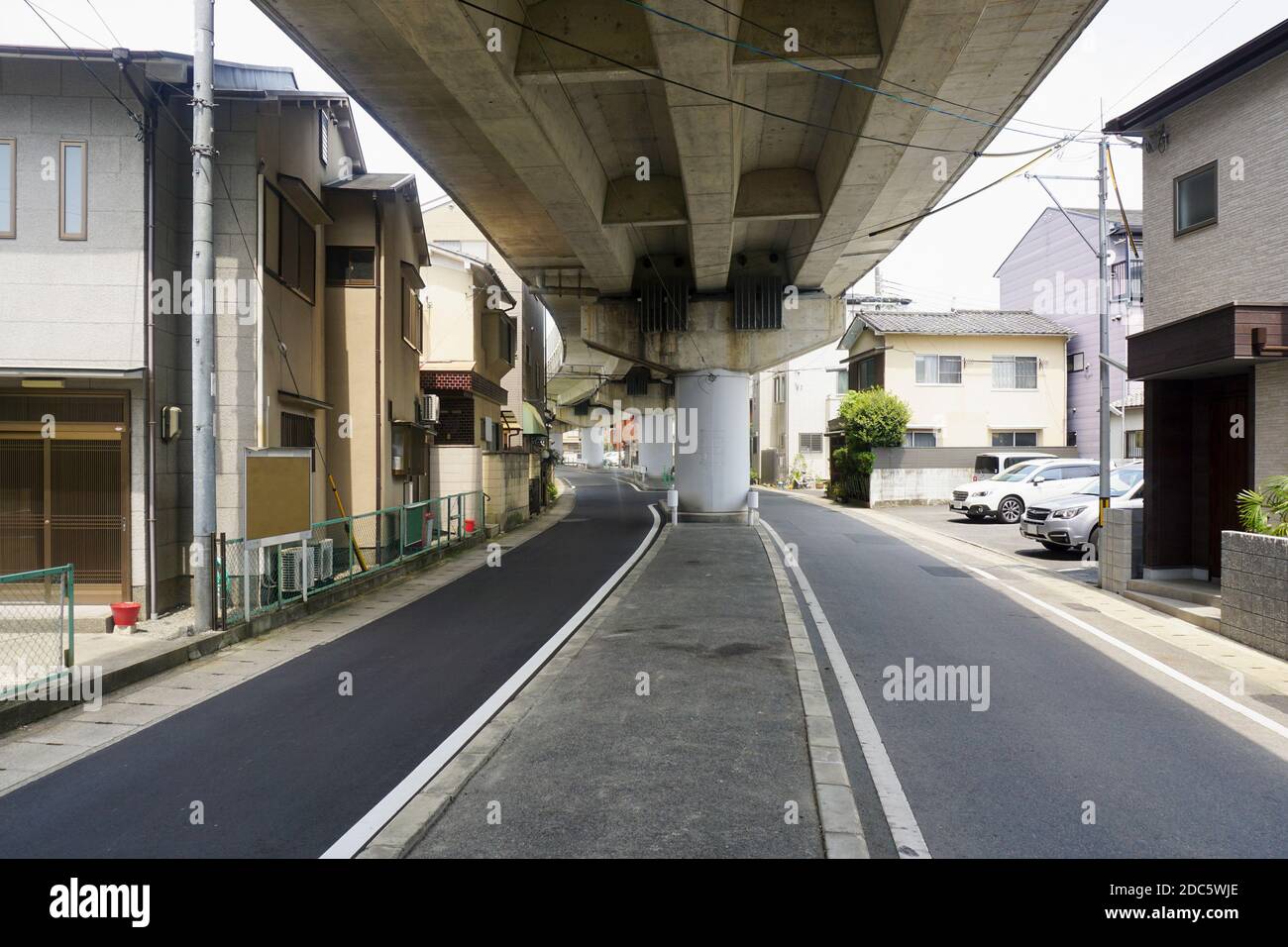 Overpass and street splitting urban neighborhood, Kyoto, Japan Stock ...
