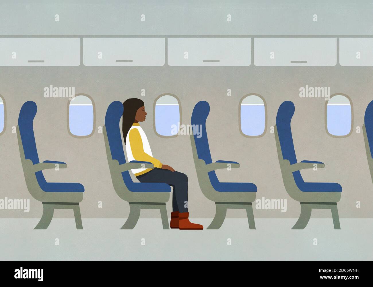 Woman riding airplane alone Stock Photo - Alamy