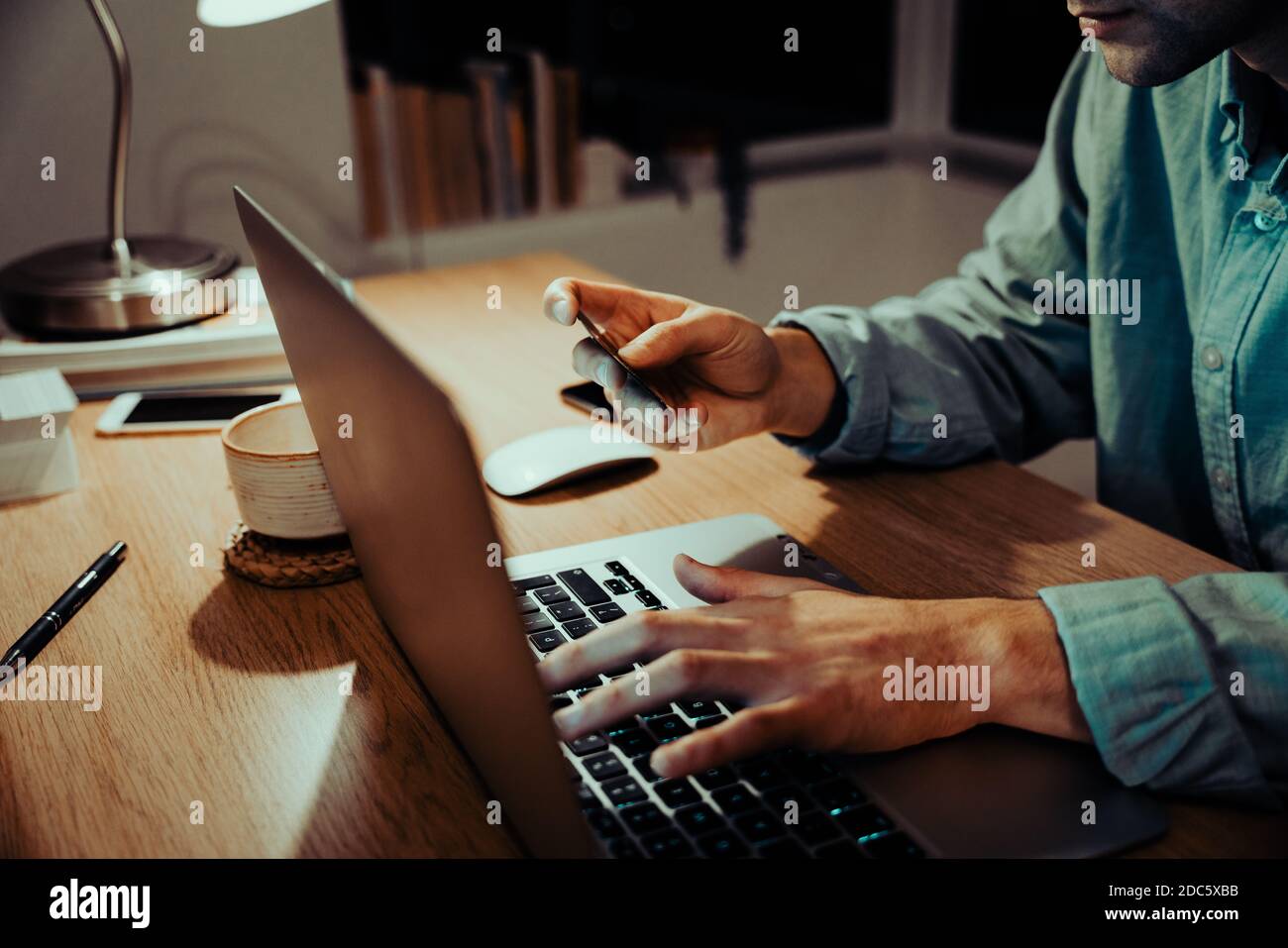 Close up of caucasian male business designer working on laptop making ...