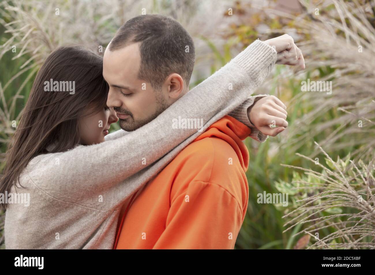 Affectionate, sensual young couple hugging Stock Photo - Alamy