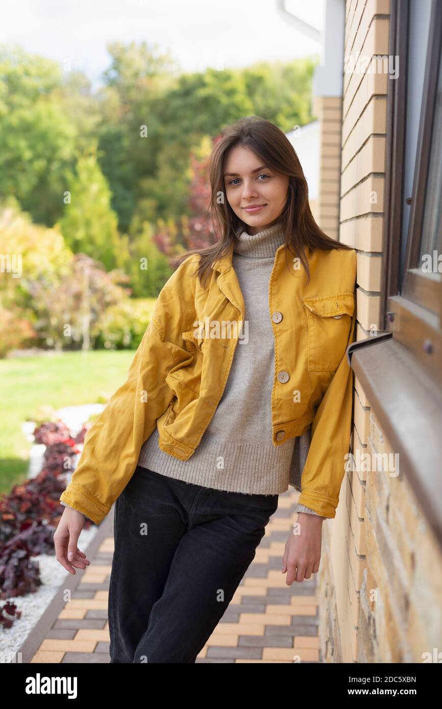 Woman in yellow jacket hi-res stock photography and images - Alamy
