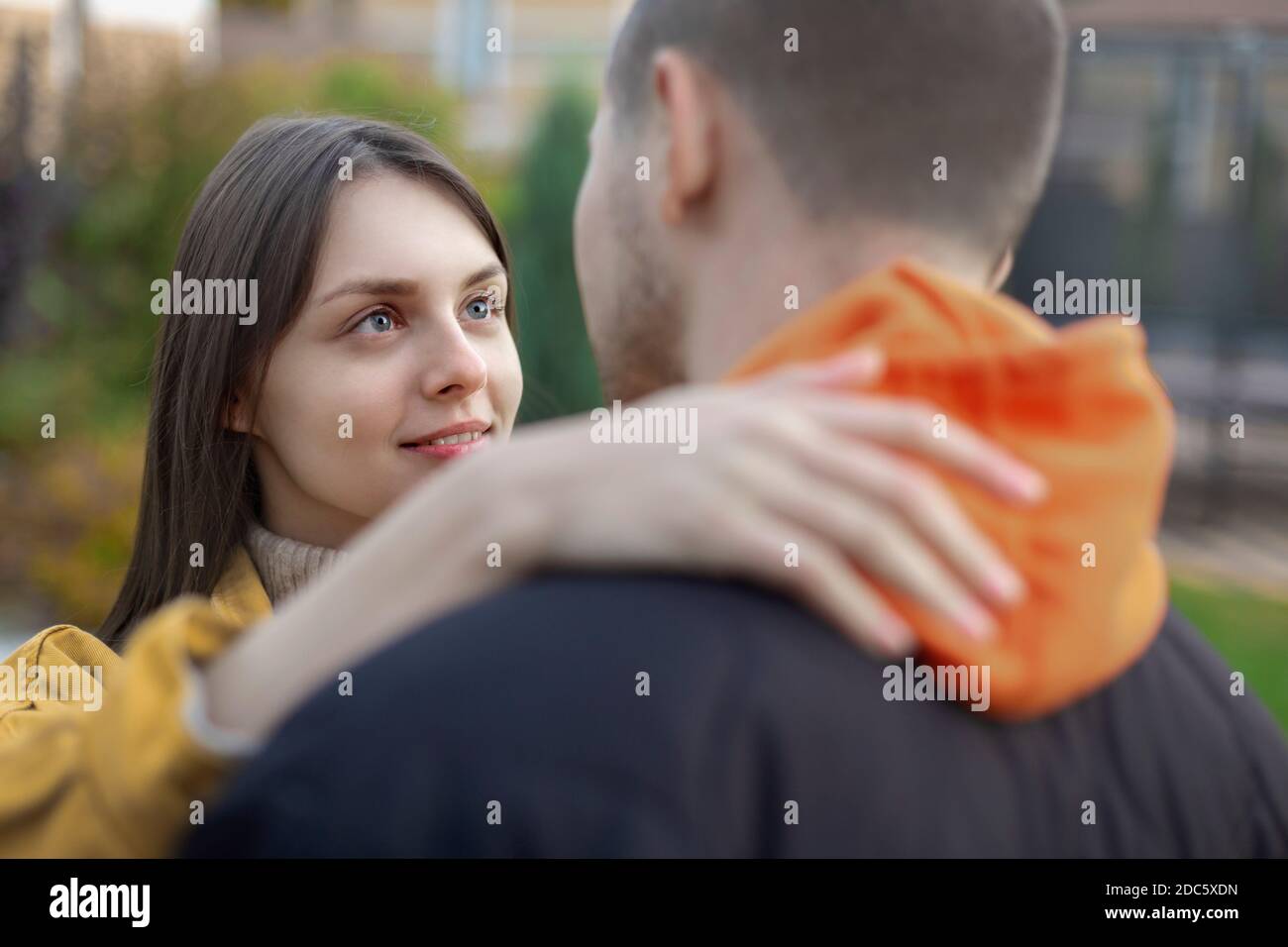 Affectionate young couple hugging Stock Photo - Alamy