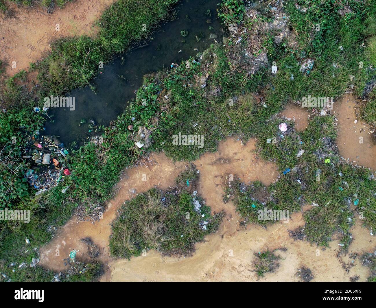 An aerial overhead shot of garbage in a natural environment - pollution ...