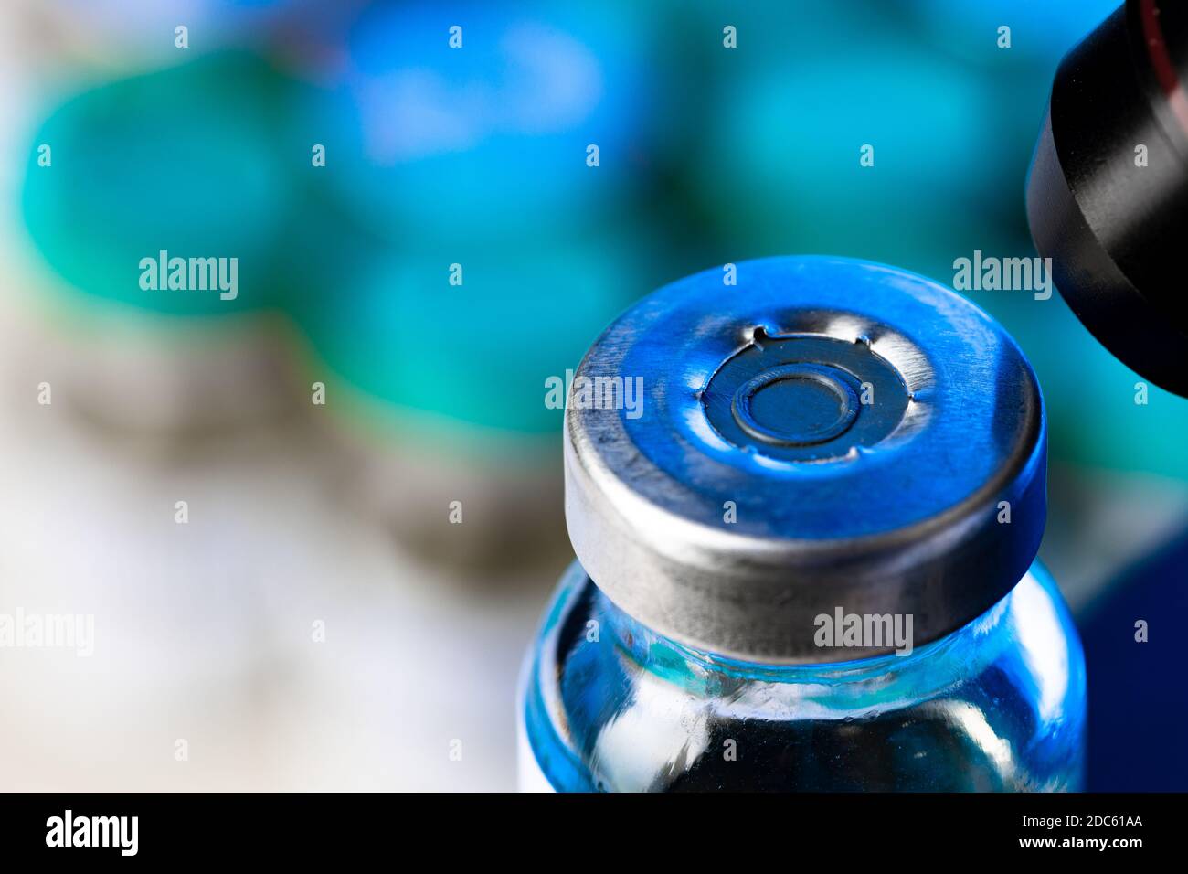 Medical vial with medication near microscope photo Stock Photo - Alamy