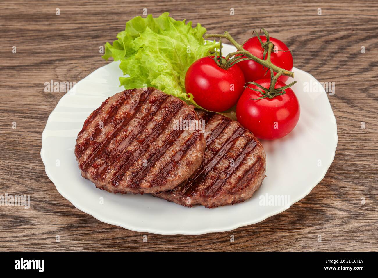 Grilled burger cutlet with tomato sauce Stock Photo - Alamy