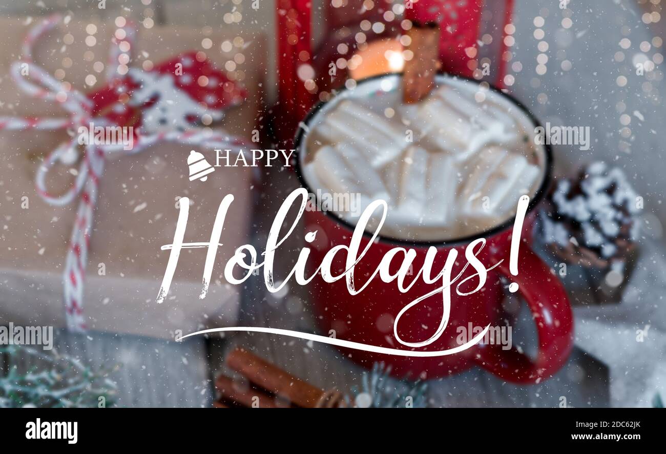 Happy holidays text with winter hot drink, cacao with marshmallows and ...