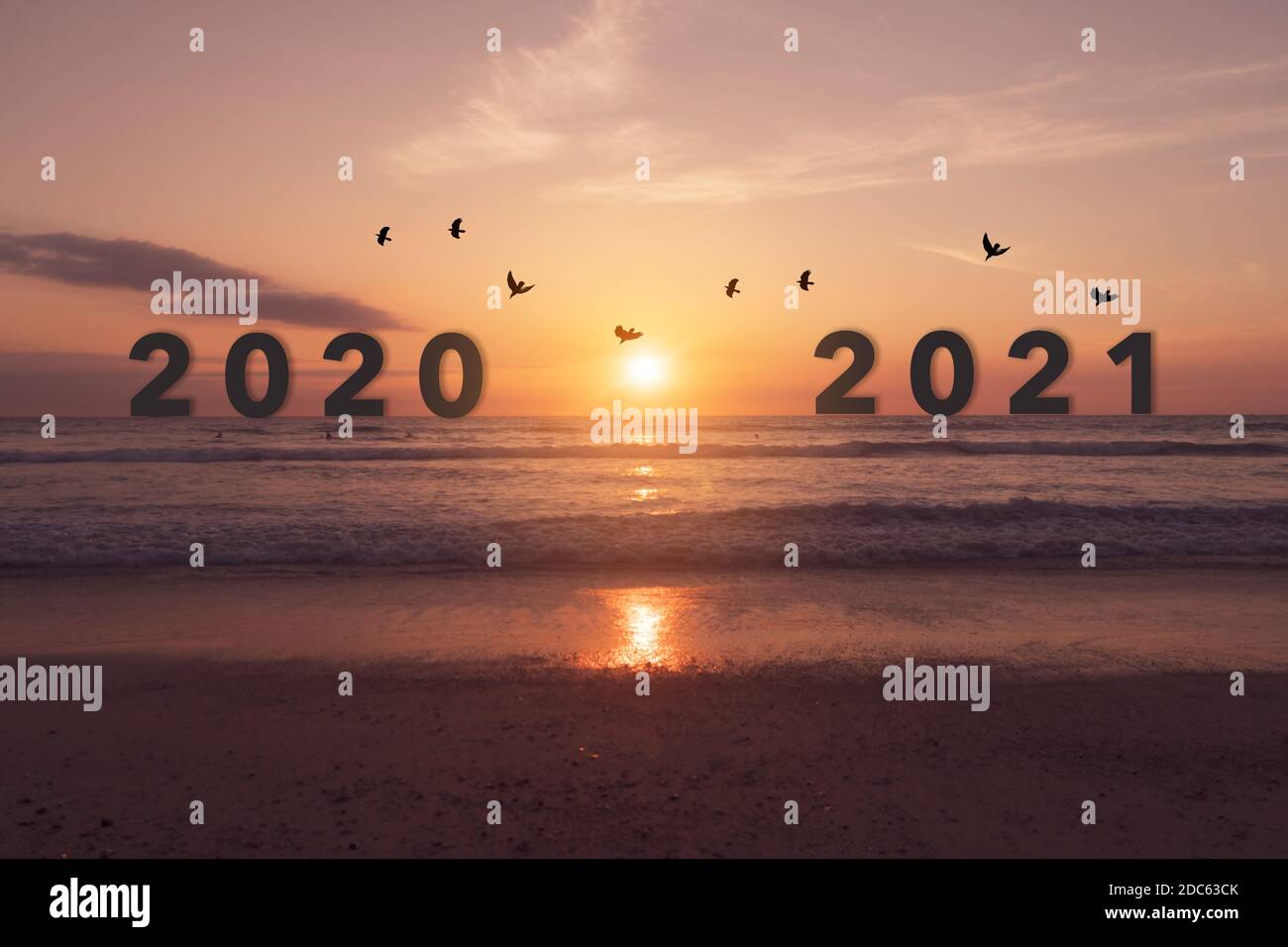 New year 2021 is coming with sunset beach background. New start for ...