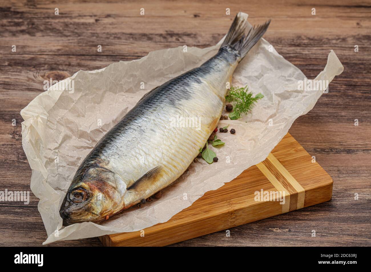 Salted Herring fish with pepper and spices Stock Photo - Alamy