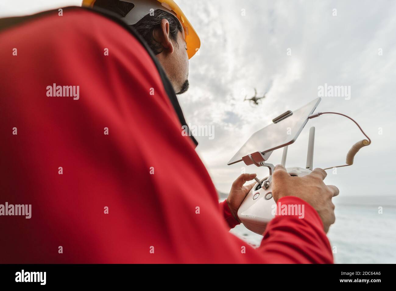 Male engineer doing inspection using drone - Technology and industrial ...