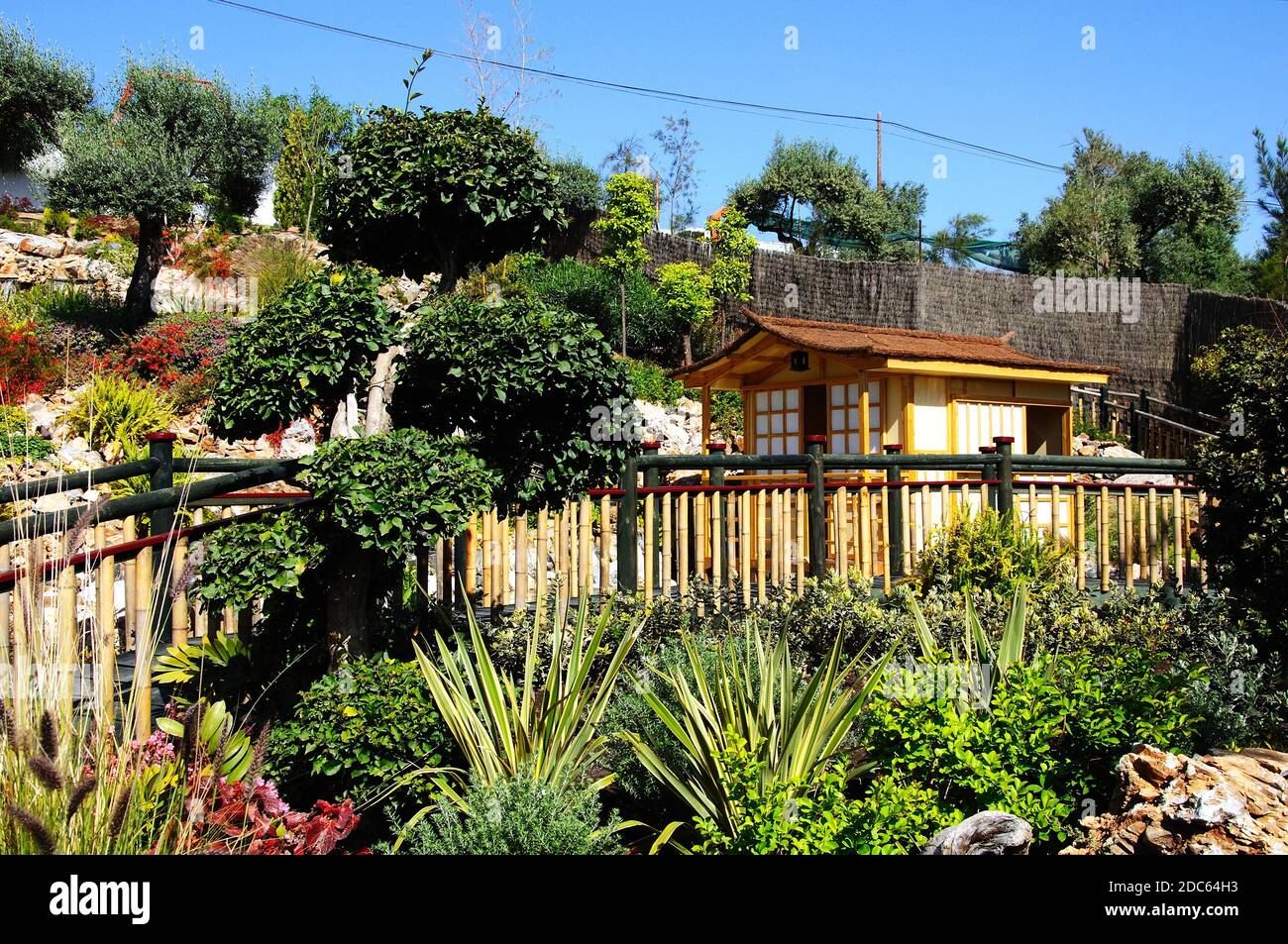 Wooden building built on stilts in an ornamental pool in the Oriental ...