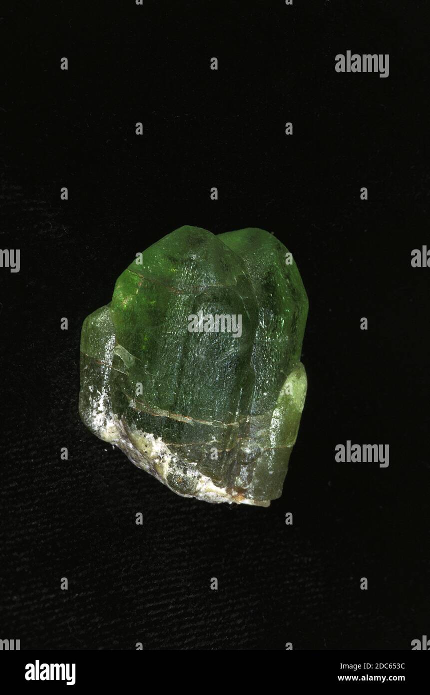 PERIDOT STONE AGAINST BLACK BACKGROUND Stock Photo - Alamy