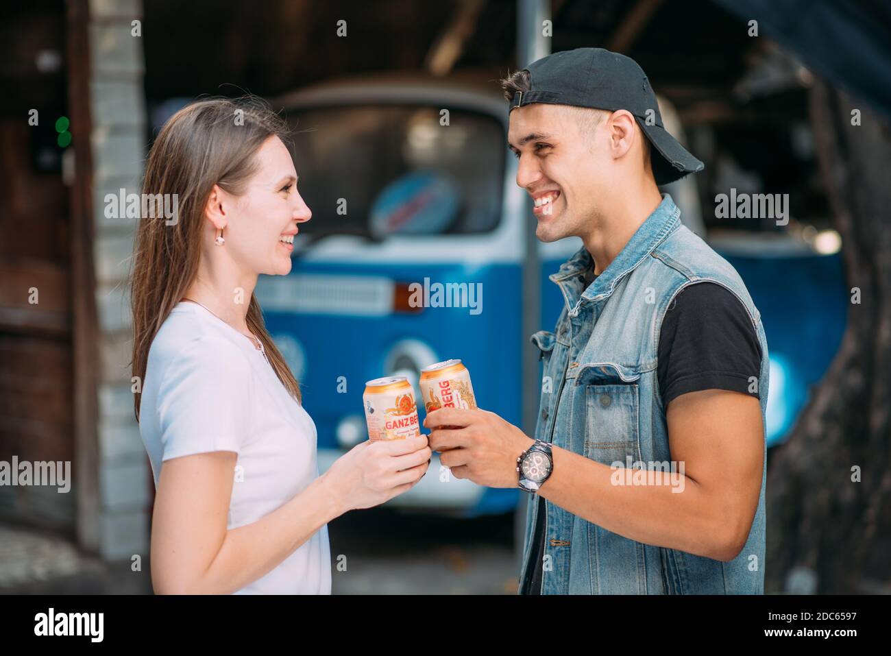 Beer Party - Young couple enjoying hot summer day at a rooftop party ...