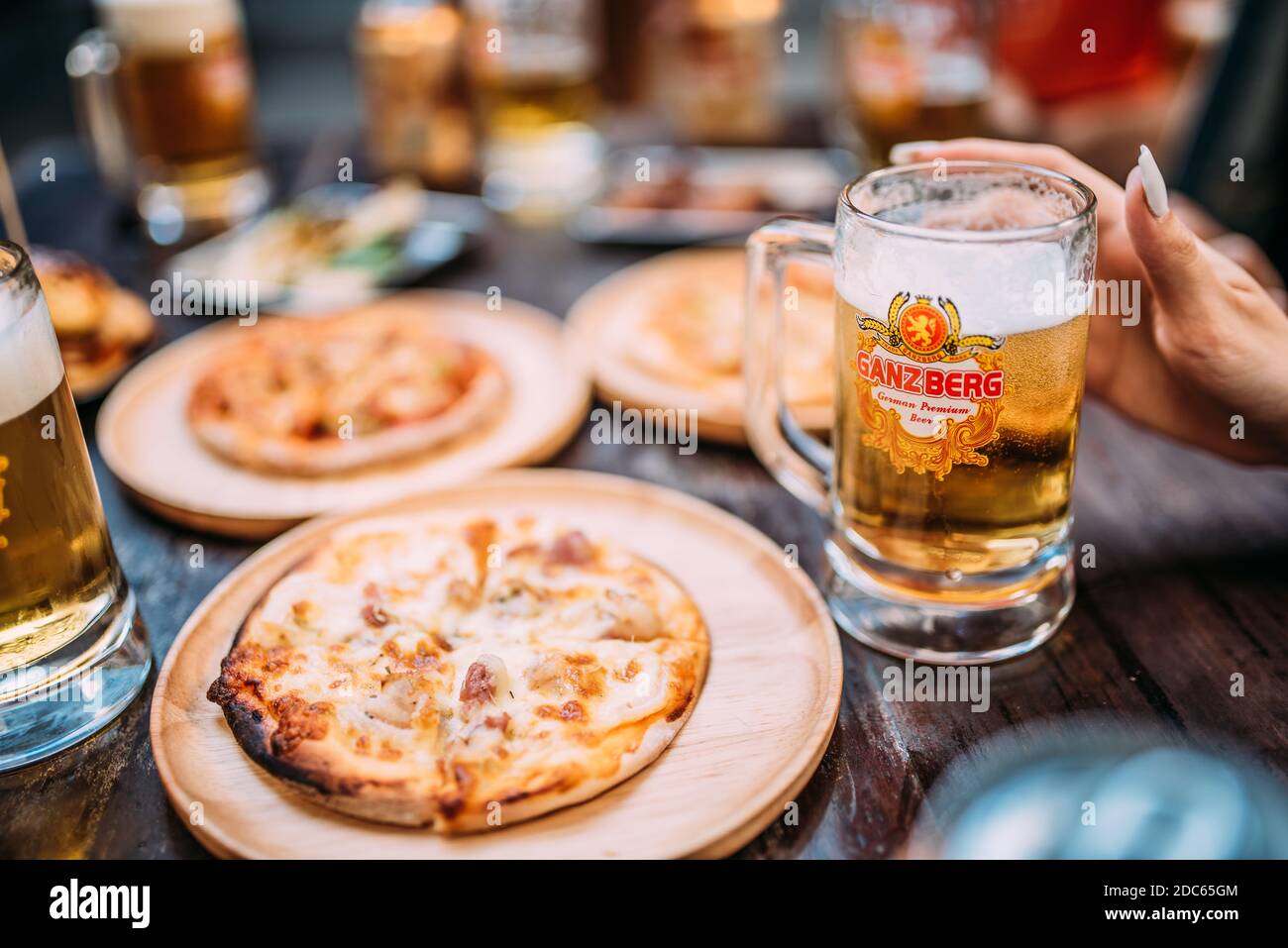 Party beer Happy friends group drinking Ganzberg beer at brewery bar ...