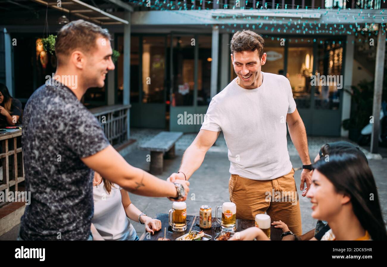 Party beer with friends drinking Ganzberg beer and toasting beer at ...