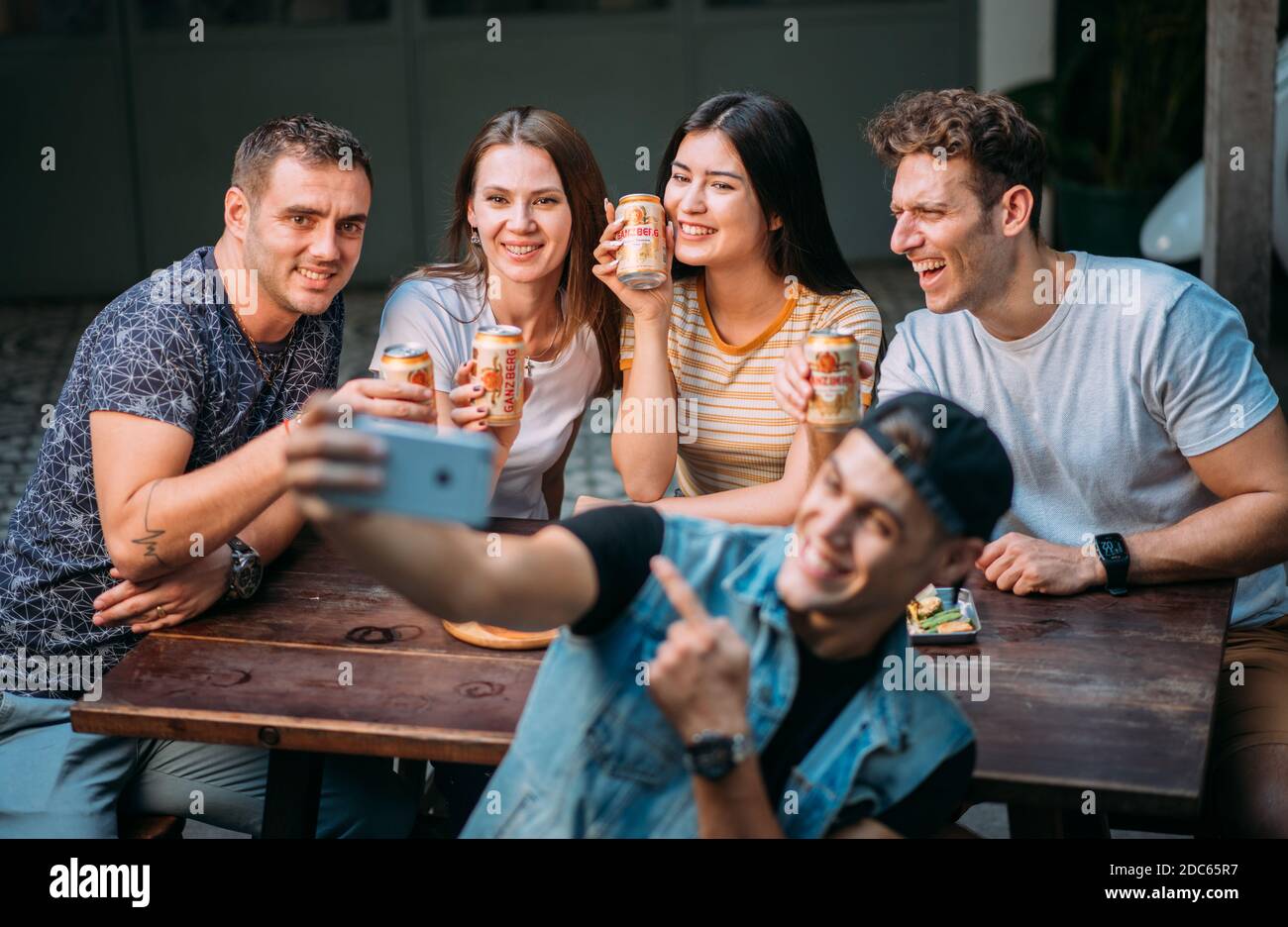 Party beer with friends drinking Ganzberg beer and toasting beer at ...