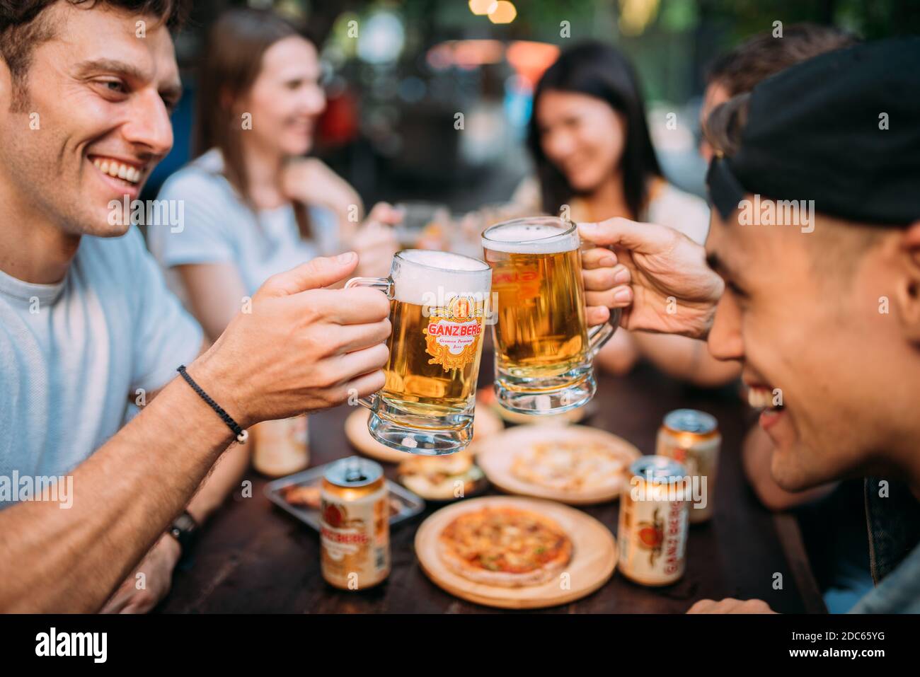 Party beer with friends drinking Ganzberg beer and toasting beer at ...