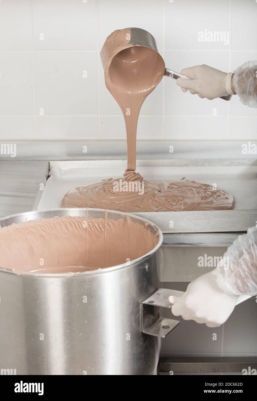 A vertical shot of a cake making process Stock Photo - Alamy