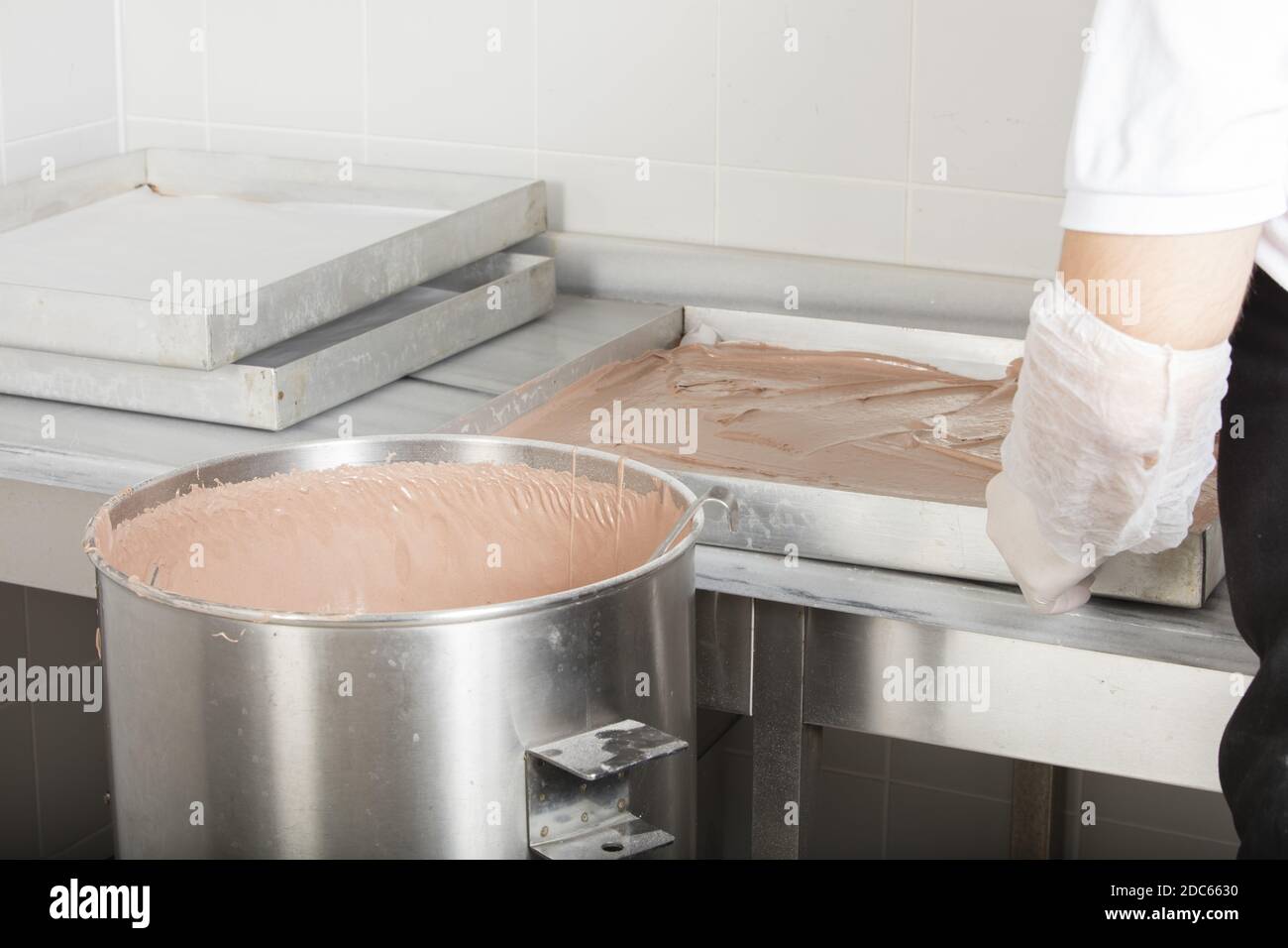 A vertical shot of a cake making process Stock Photo - Alamy