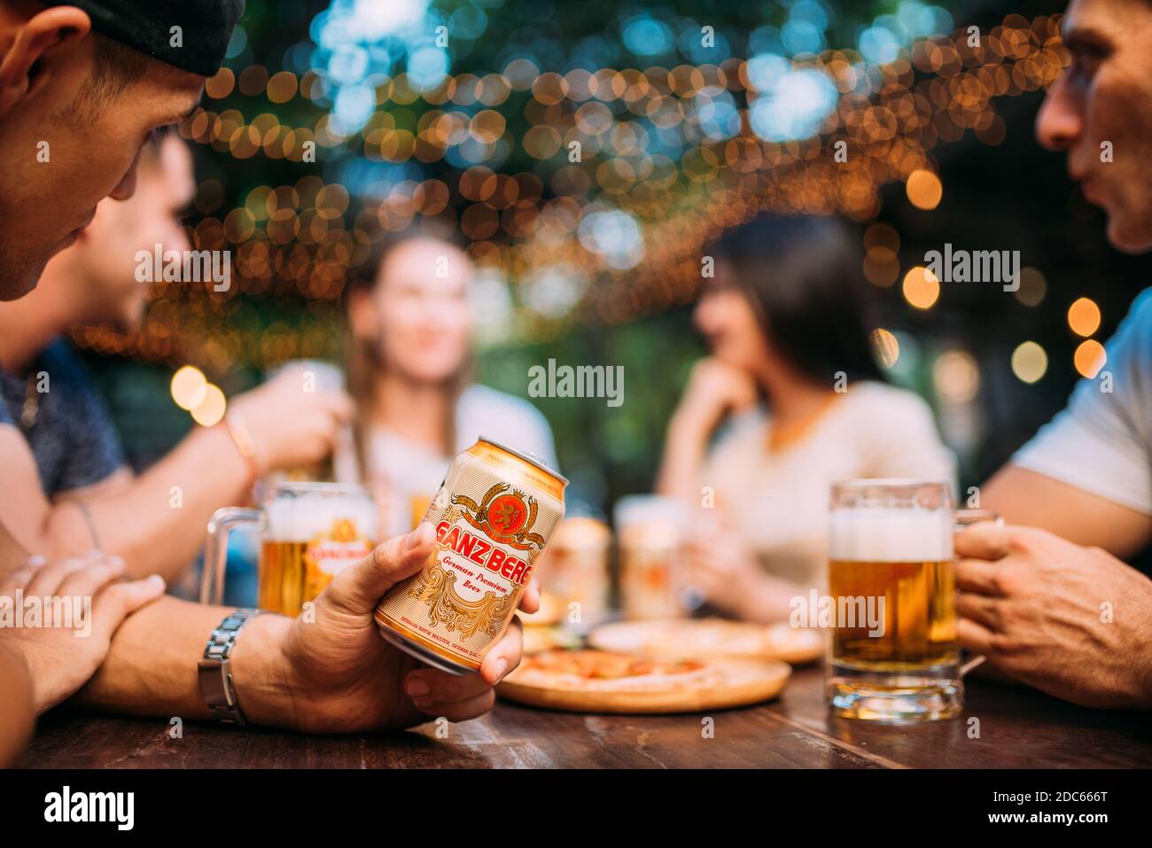 Party beer with friends drinking Ganzberg beer and toasting beer at ...