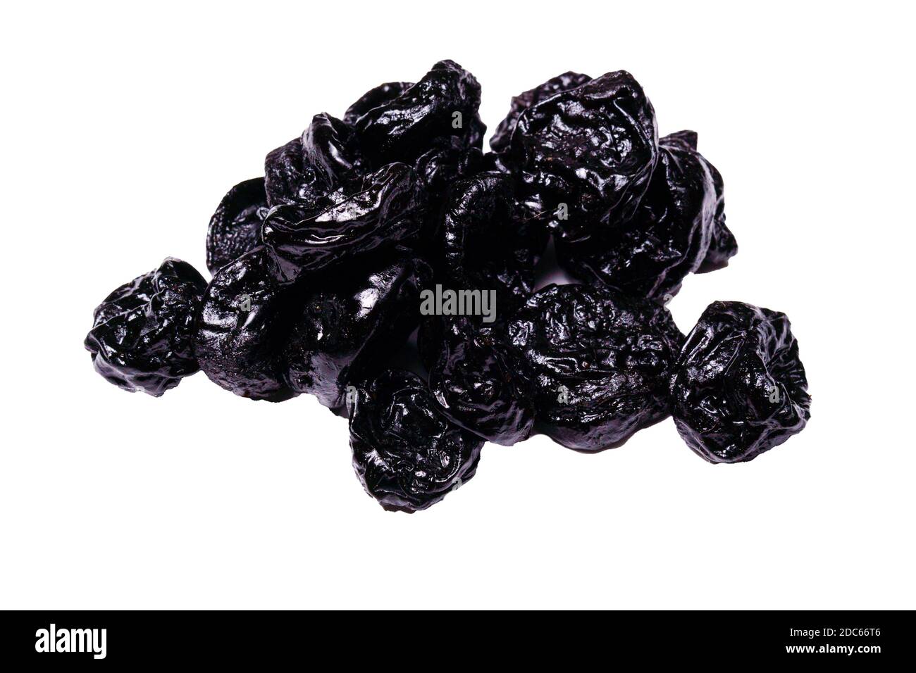Raw organic prunes, dried plums, smoked prunes close-up isolated on ...