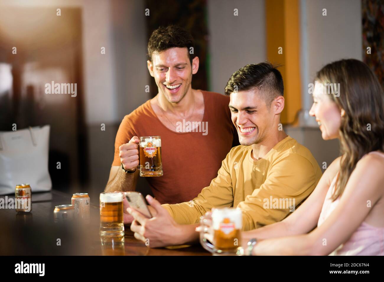 Party beer Happy friends group drinking Ganzberg beer at brewery bar ...