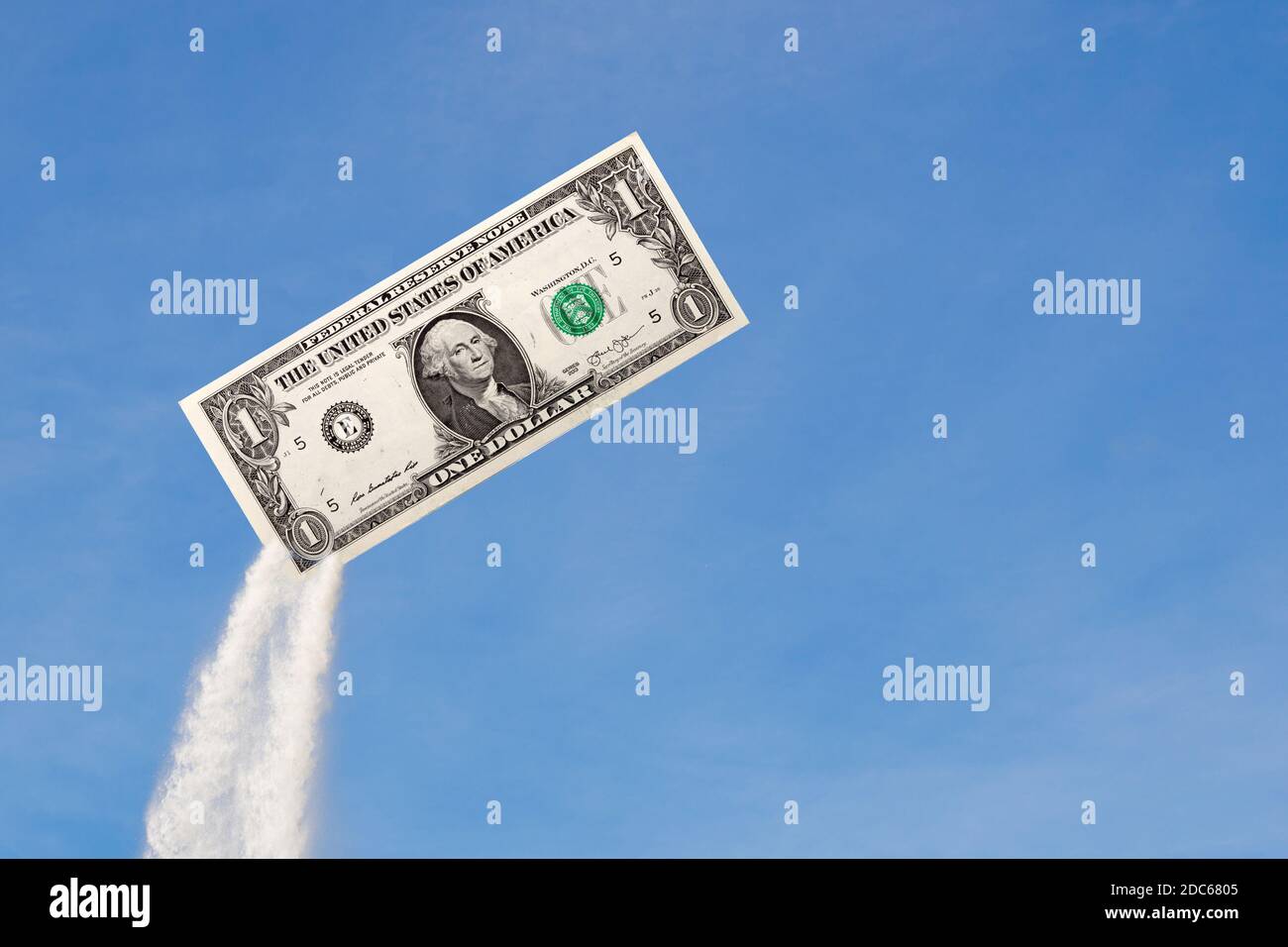 a dollar flying into the sky Stock Photo - Alamy