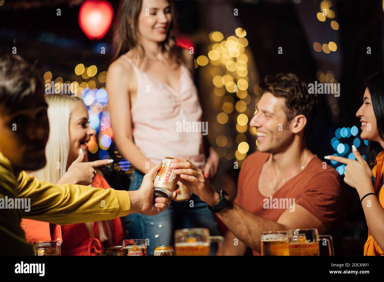 Party beer with friends drinking Ganzberg beer and toasting beer at ...