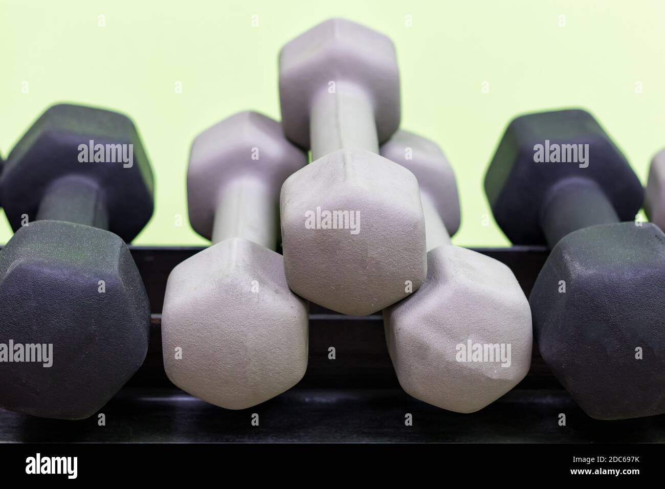 dumbbell set close-up on rack in sport fitness gym center workout ...