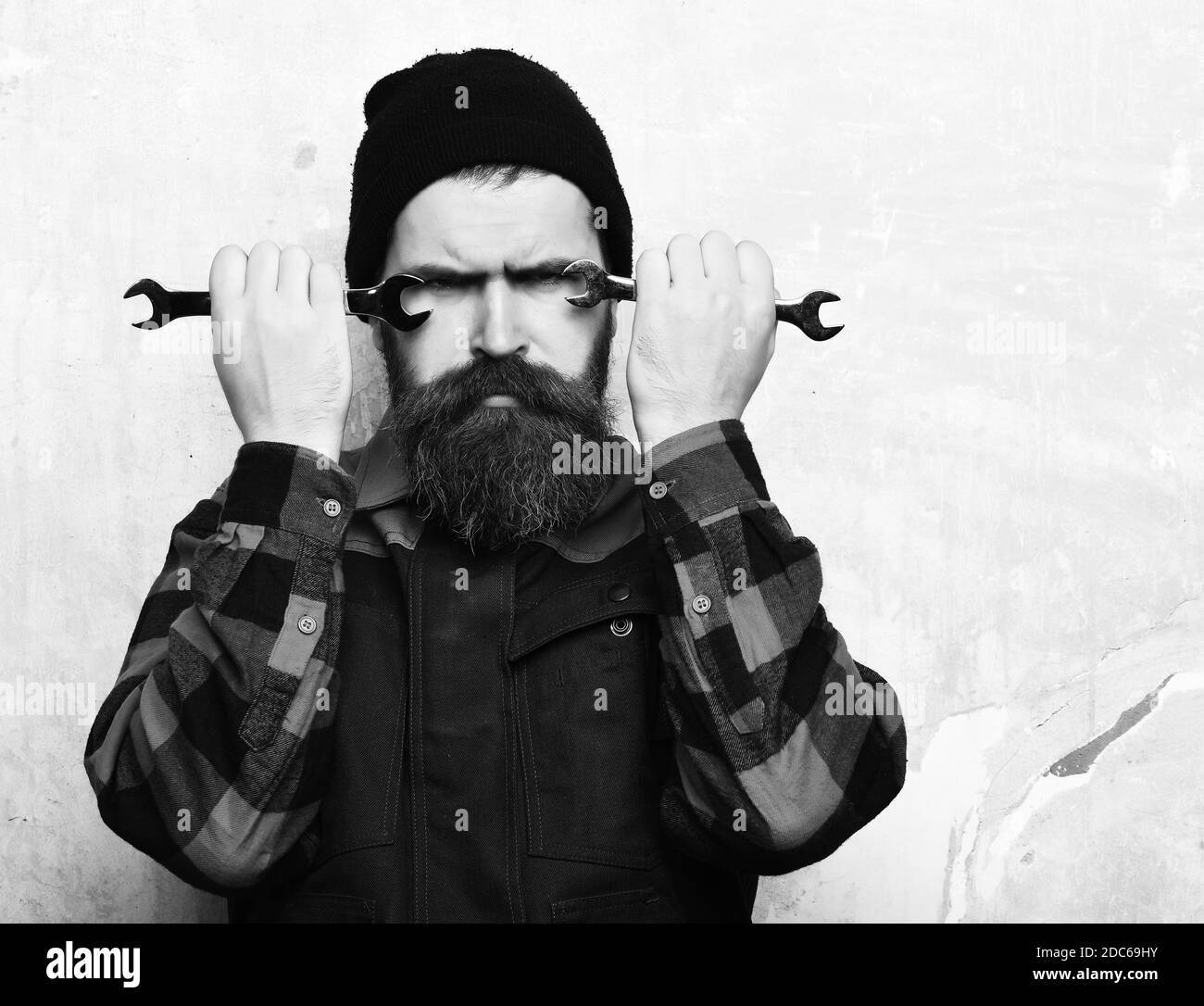 Bearded man, long beard. Brutal caucasian mechanic, unshaven hipster in ...