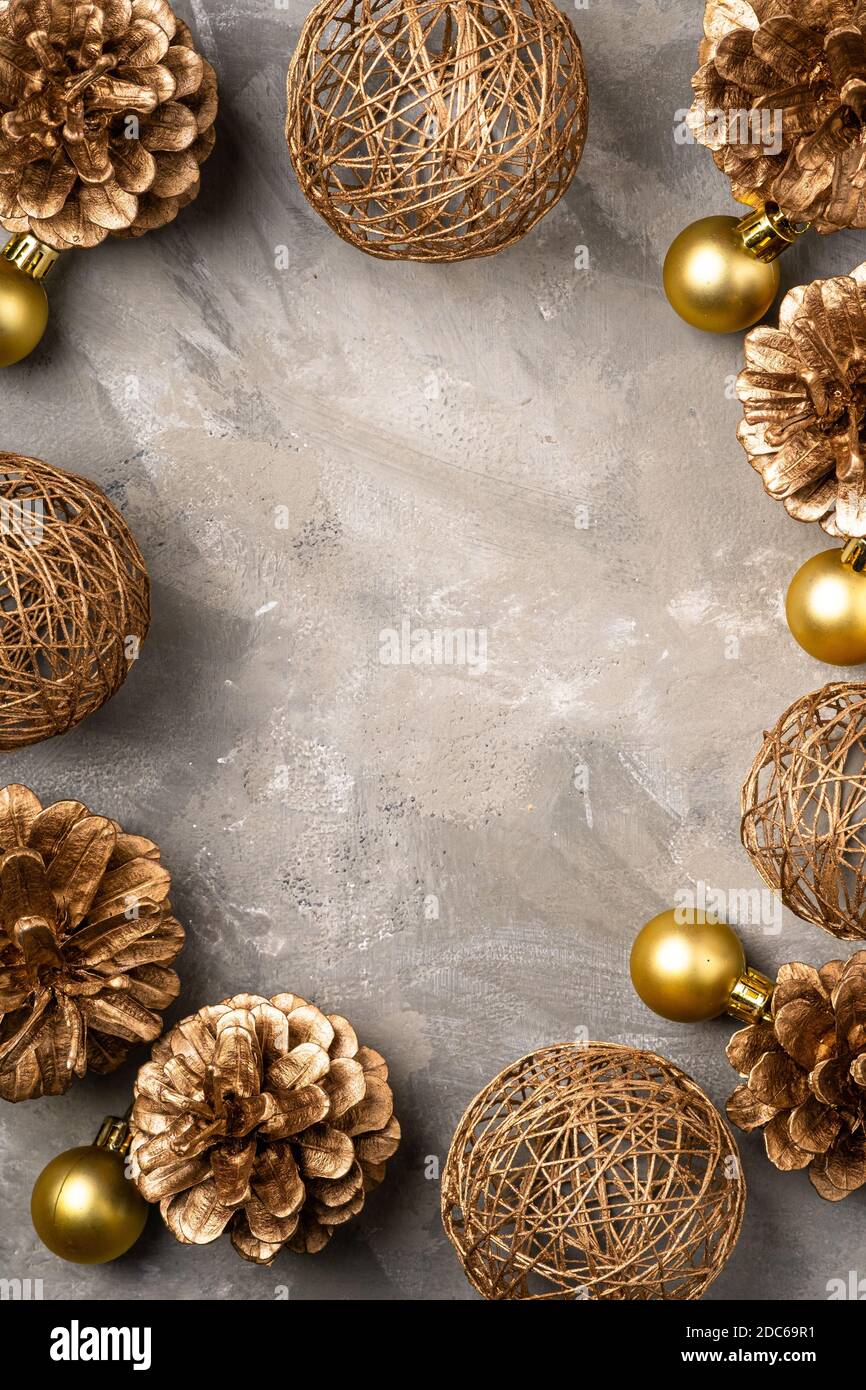 Christmas composition with copy space. Golden ornament, pine cones ...