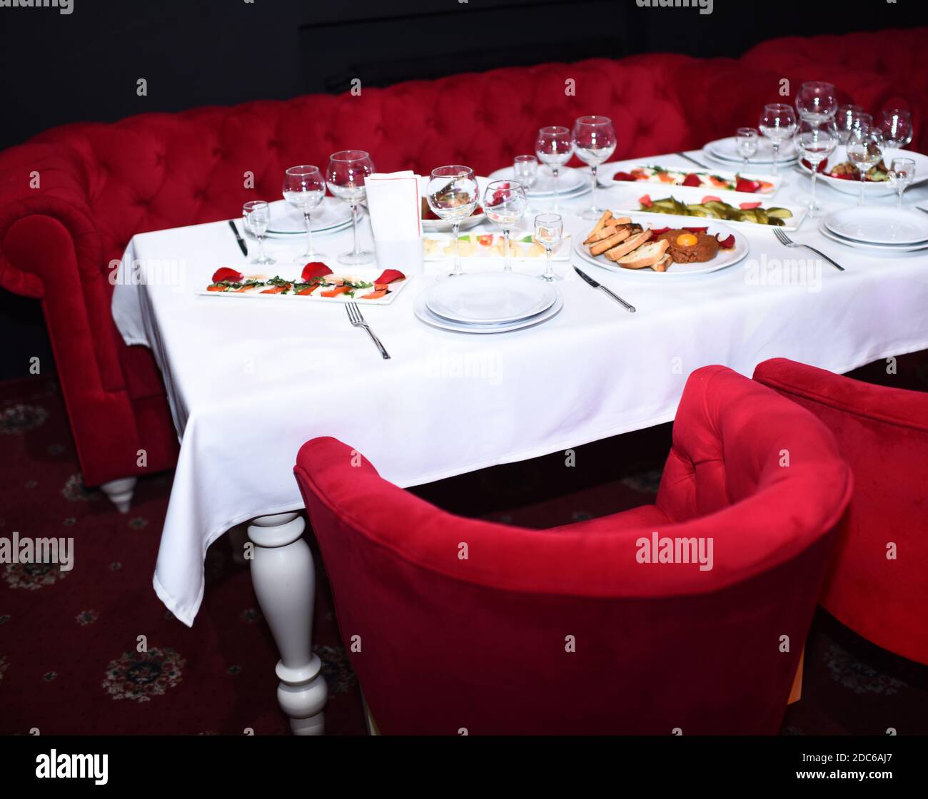 Restaurant table served with snacks and salads. Banquet table full of ...