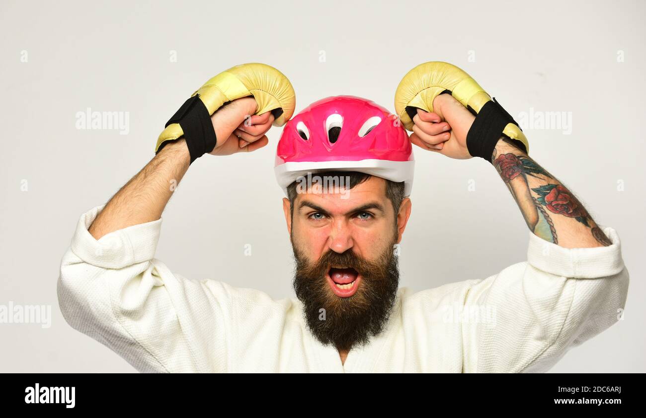 Man with beard in kimono and pink helmet on white background. Karate ...