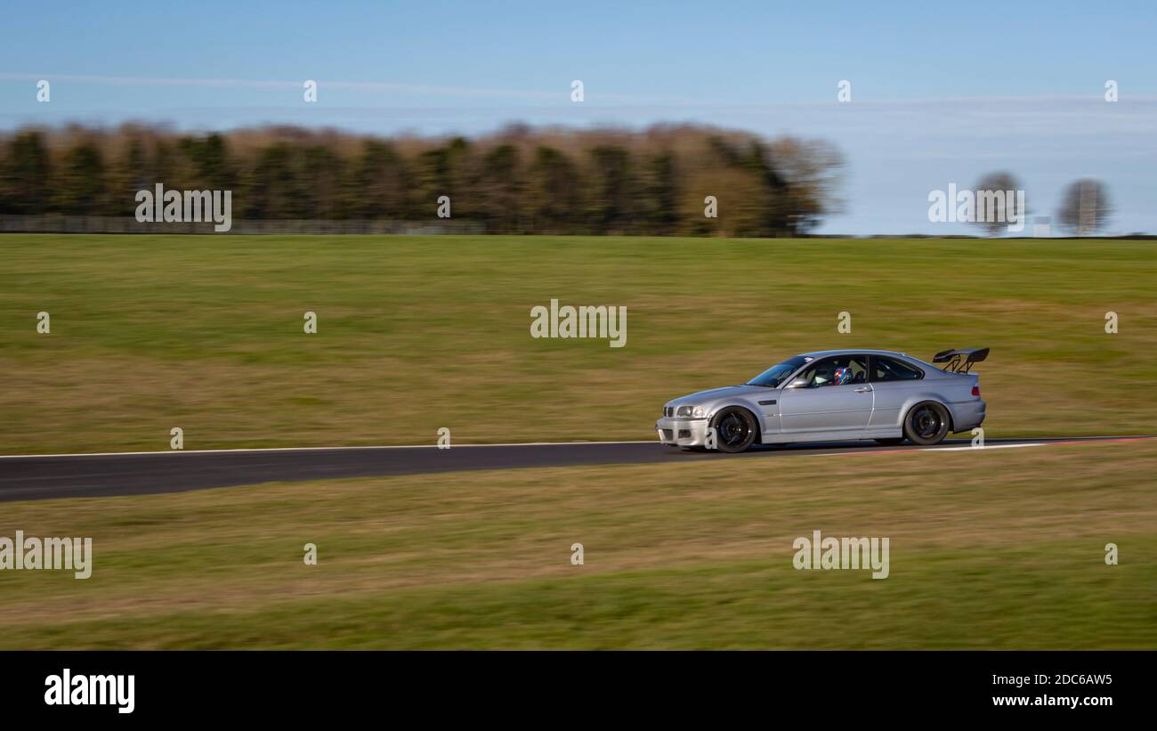 A panning shot of a racing car as it circuits a track Stock Photo - Alamy