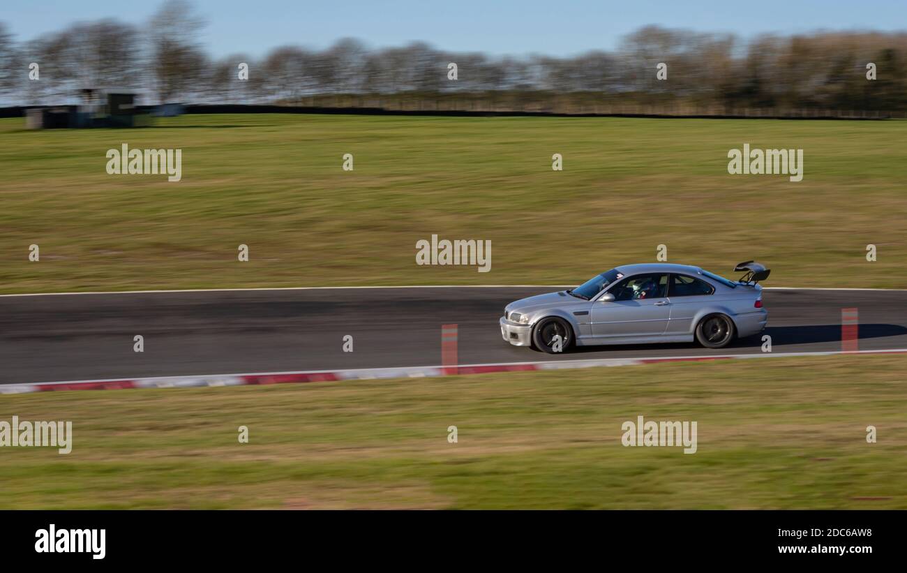 A panning shot of a racing car as it circuits a track Stock Photo - Alamy