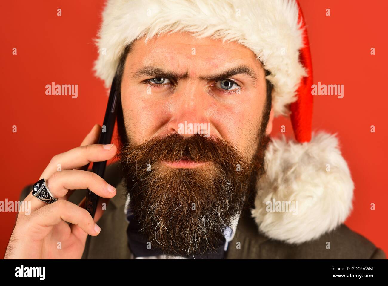 Businessman with grumpy face in close up. Man with beard leads ...