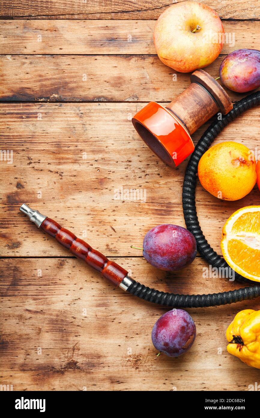 Smoking hookah with fresh fruit aroma.Tobacco fruit shisha.Copy space ...