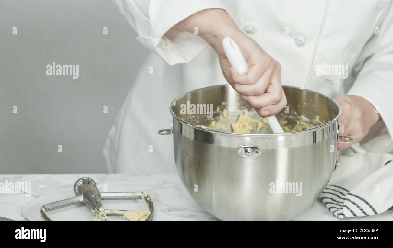 Step by step. Mixing ingredients in standing kitchen mixer to bake ...